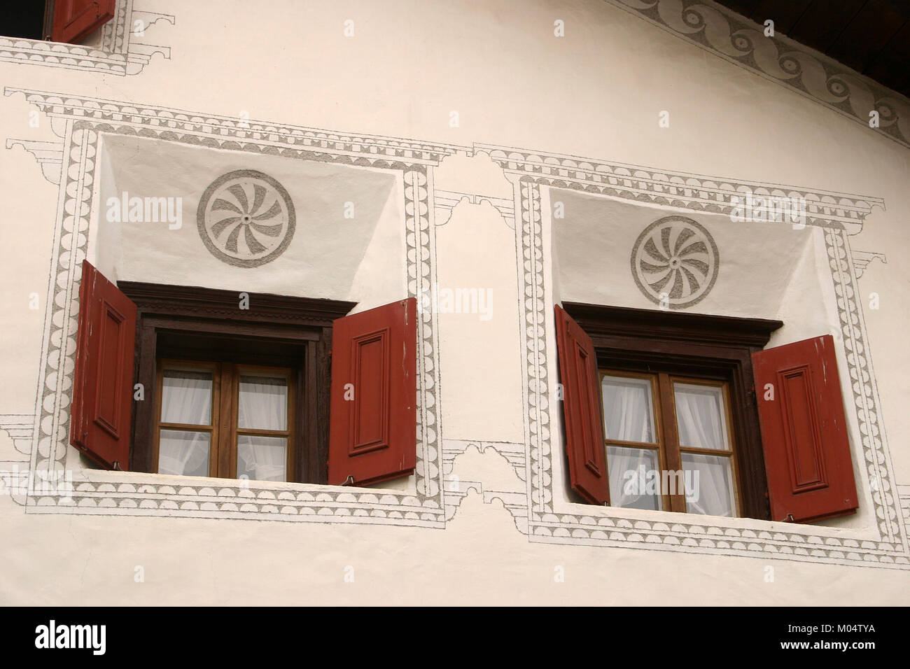 Beautifully ornamented windows in the village of Guarda, Switzerland ...