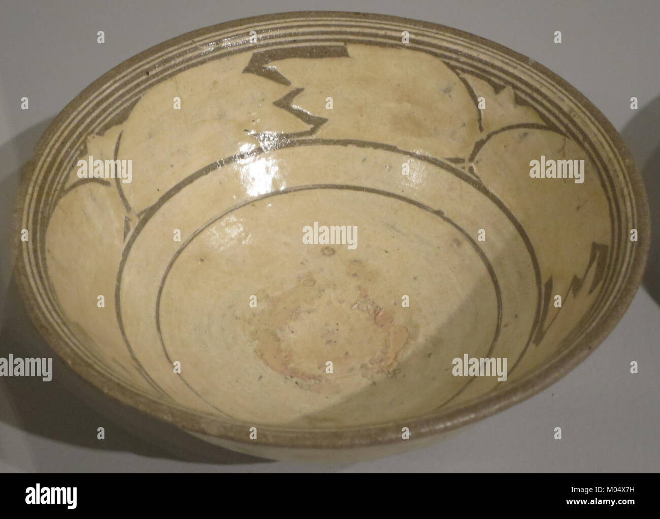 A Buncheong ware bowl featuring a peony design, part of the collection ...