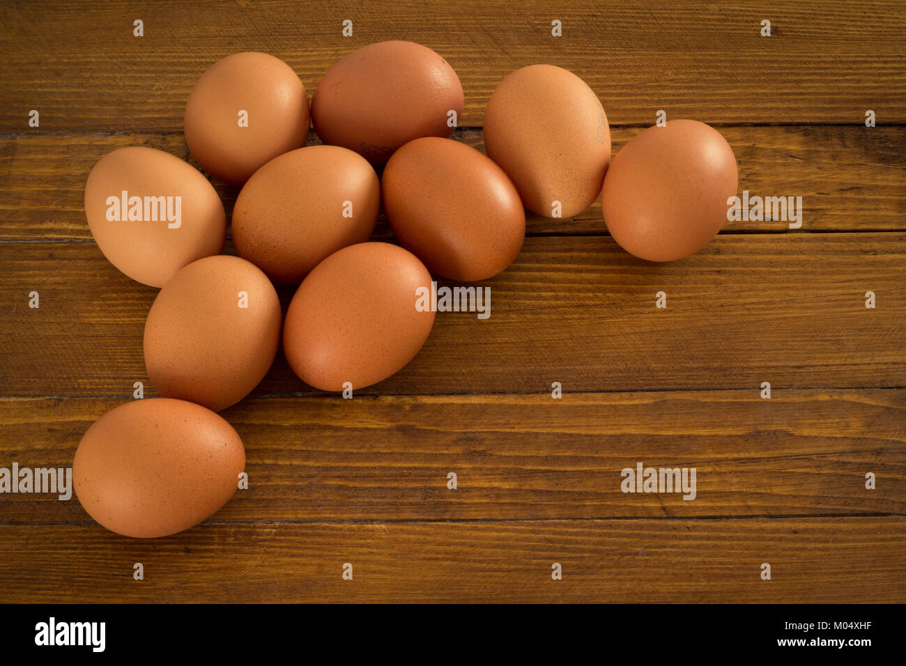 Fresh eggs on wooden hi-res stock photography and images - Alamy