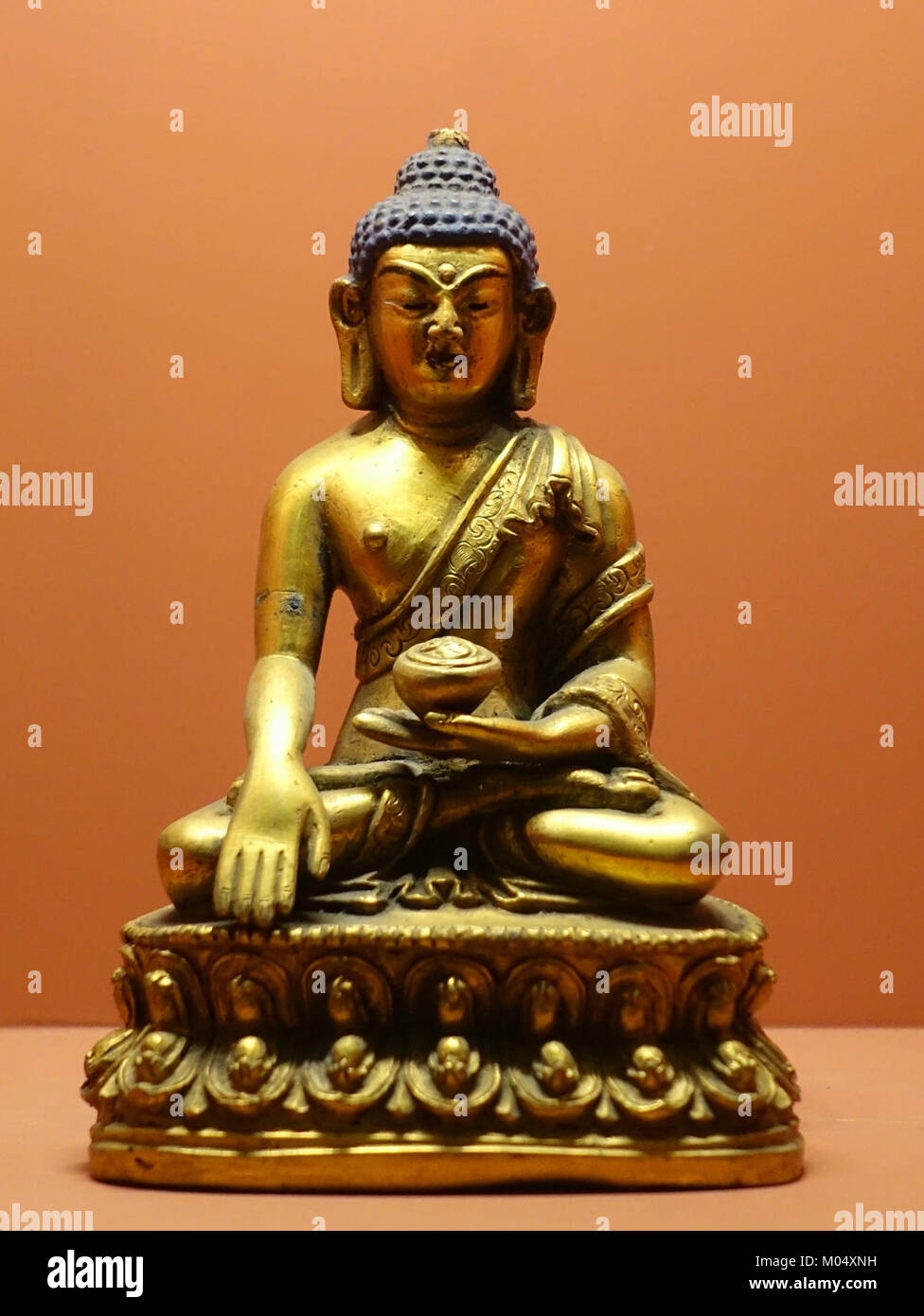 This gilt copper Buddha statue from Tibet is an undated artifact ...