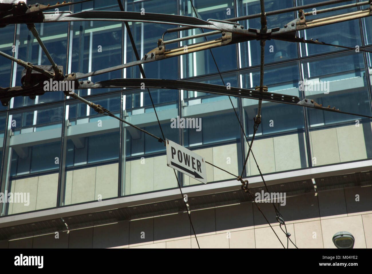 Power lines crossed above urban road closeup background Stock Photo - Alamy