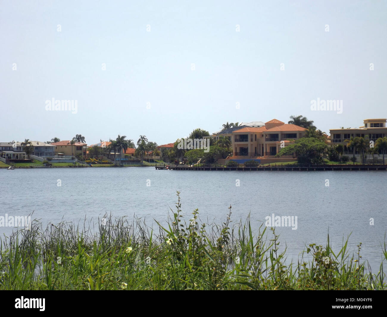 Canal and houses in Clear Island Waters, Queensland Stock Photo - Alamy