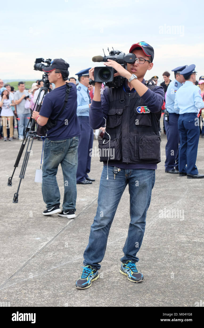 This image shows a TV cameraman capturing footage at the Hsinchu Air ...