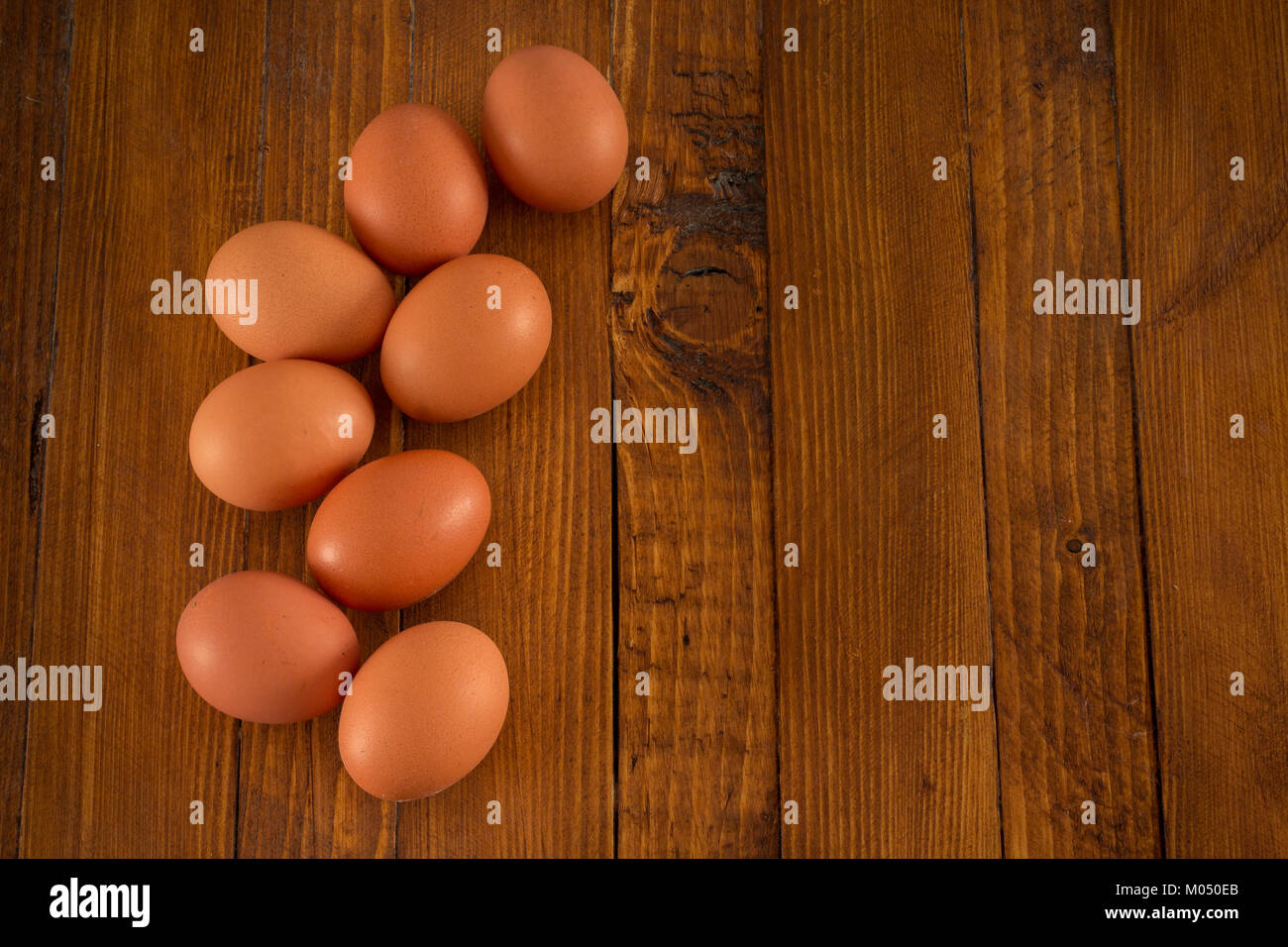 Fresh eggs on wooden hi-res stock photography and images - Alamy