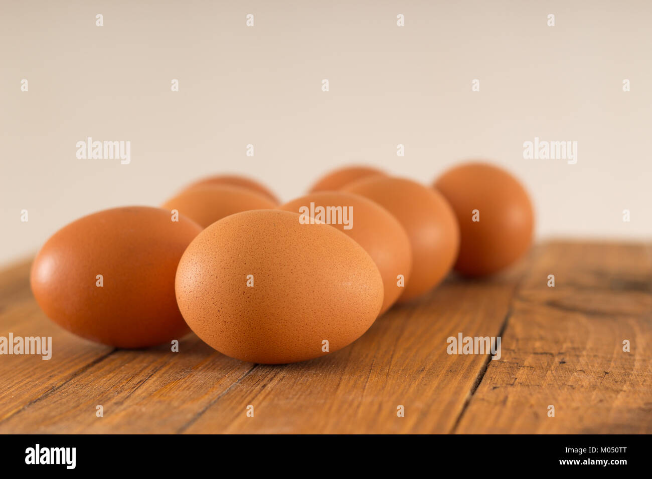 Fresh eggs on wooden hi-res stock photography and images - Alamy
