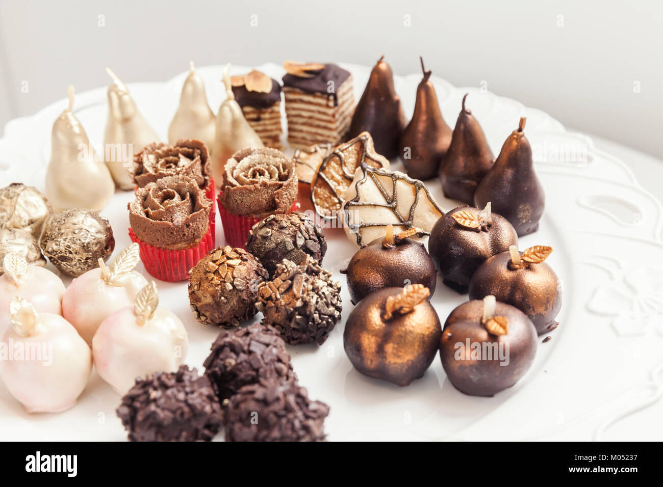 expensive small cakes made in the form of fruit Stock Photo - Alamy