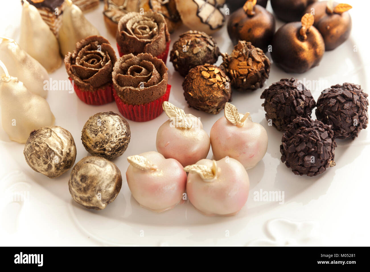 expensive small cakes made in the form of fruit Stock Photo - Alamy
