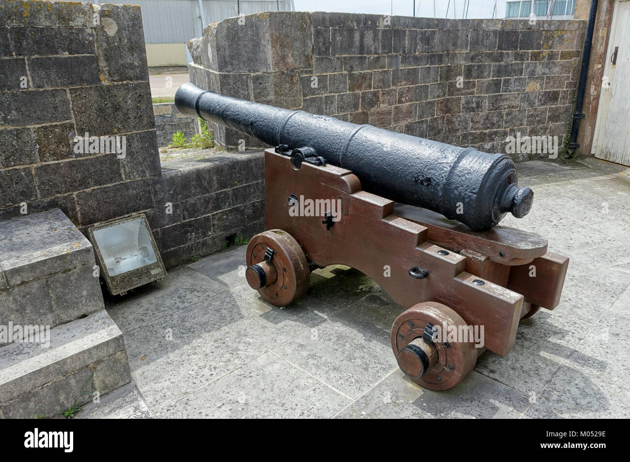 This image depicts a historic cannon placed at Calshot Castle in ...