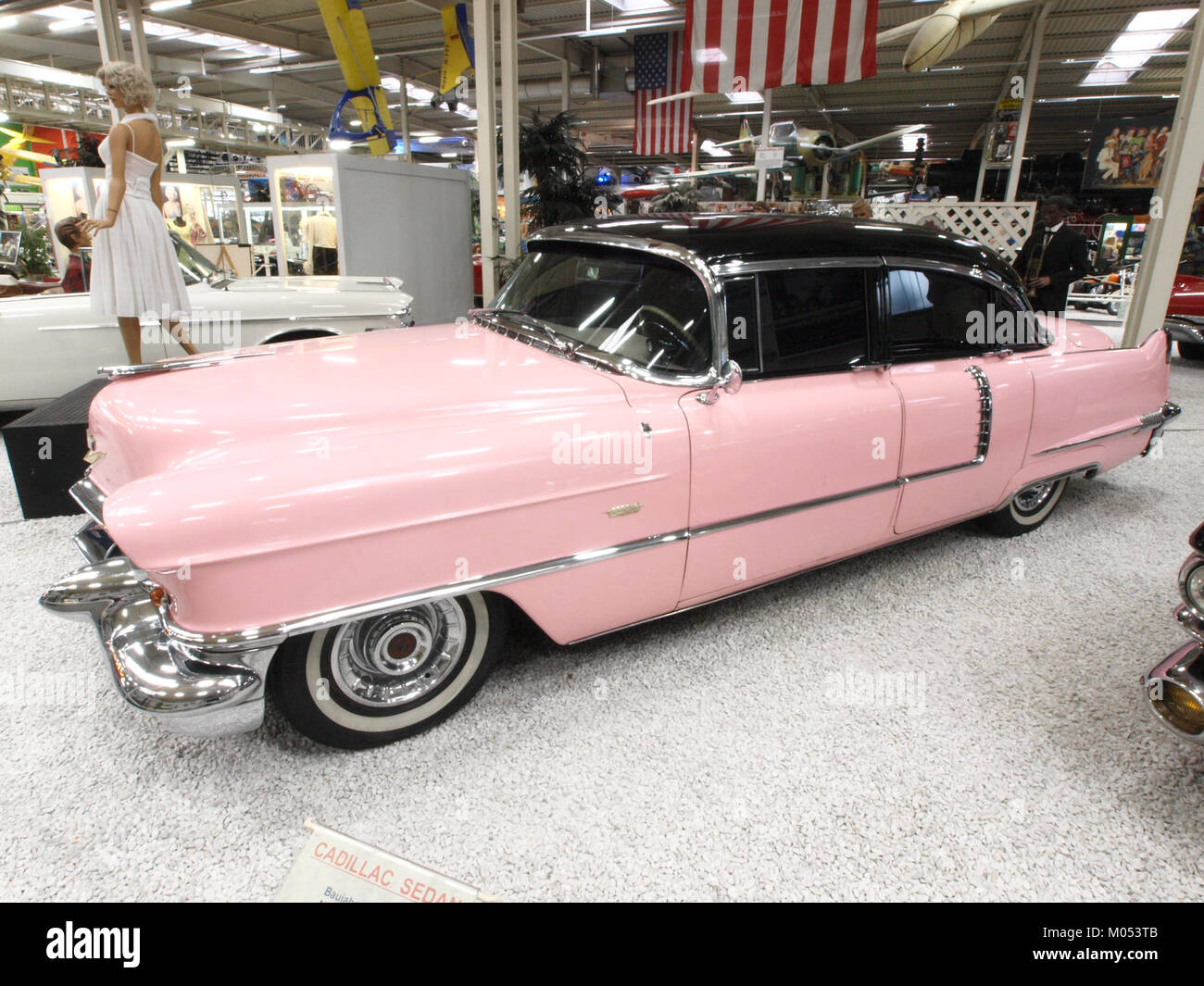 This image features a Cadillac Sedan, a luxury car produced by the ...