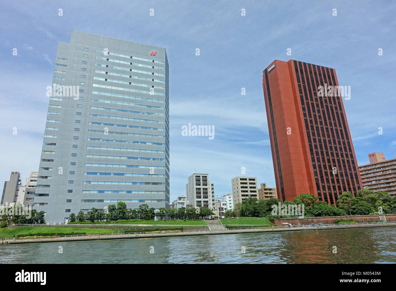 The Sumida River in Tokyo, Japan, is lined with modern buildings ...