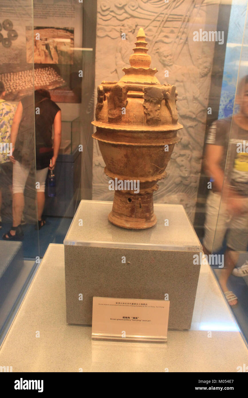 The brown-glazed pottery soul jar is a significant artifact displayed ...