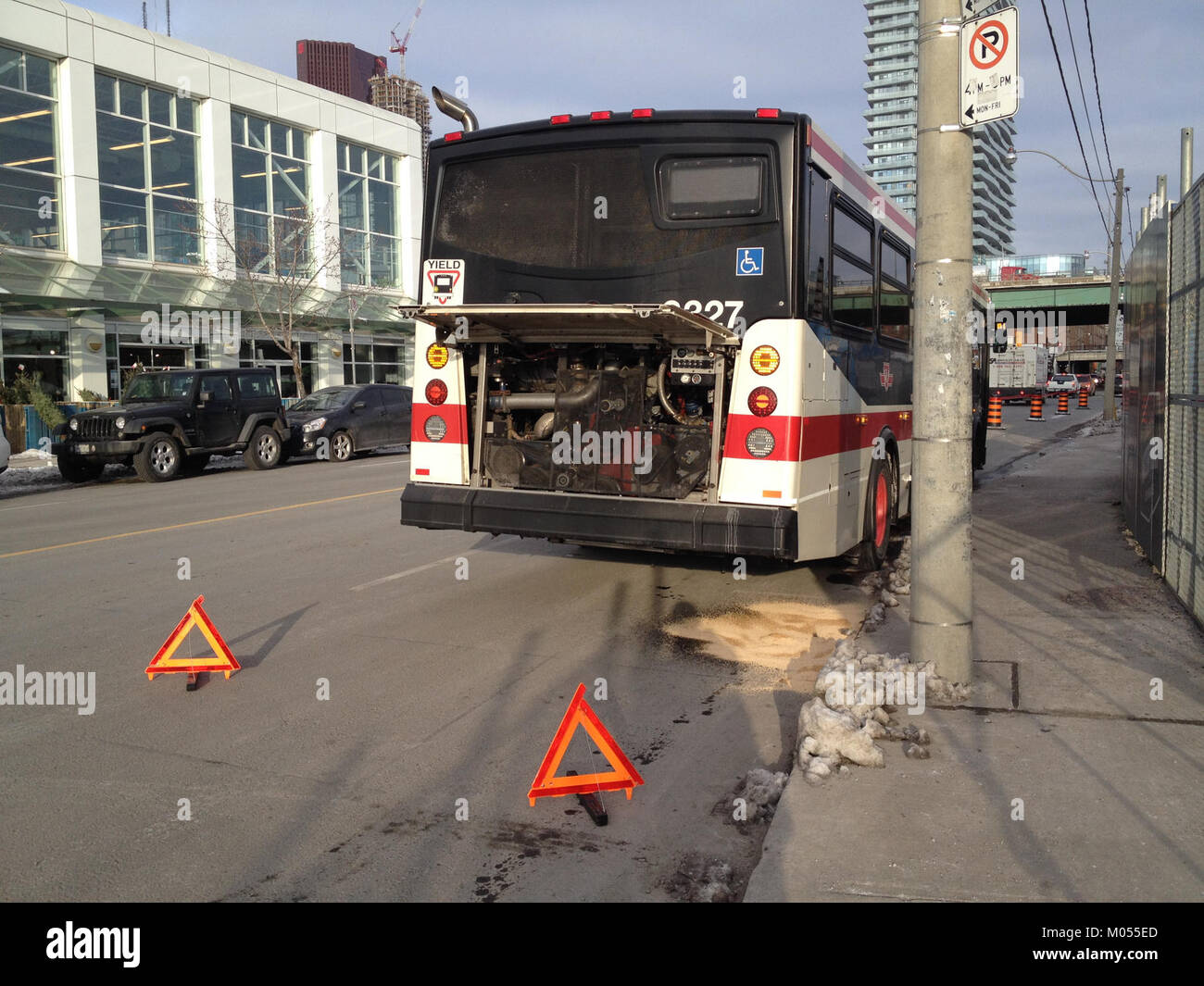 This image depicts a broken TTC (Toronto Transit Commission) bus ...