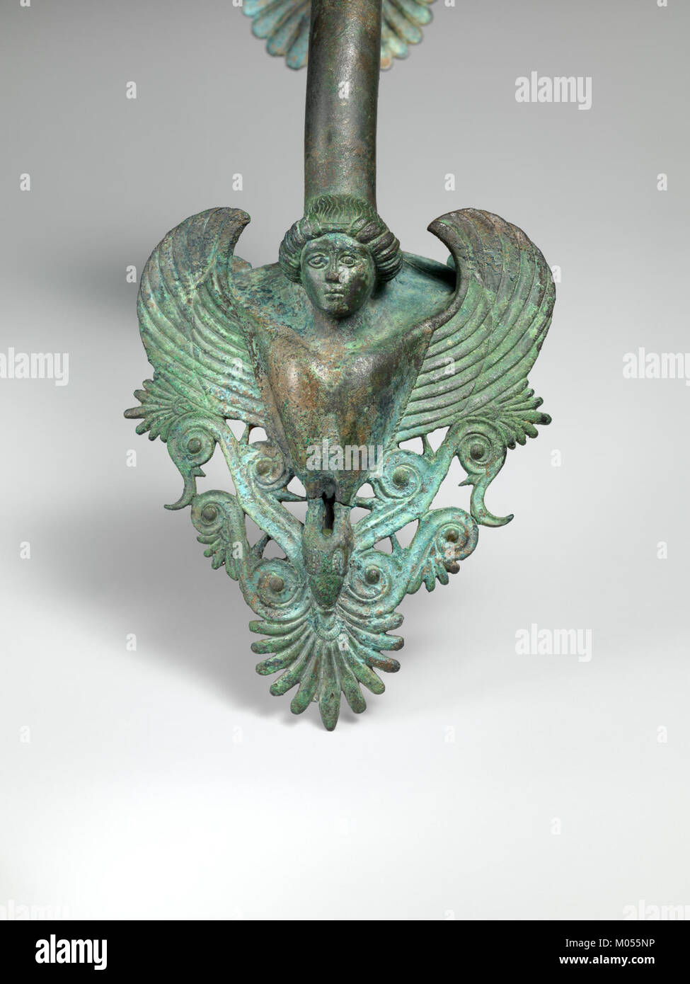 This bronze handle of a hydria, a type of ancient Greek water jar, is ...