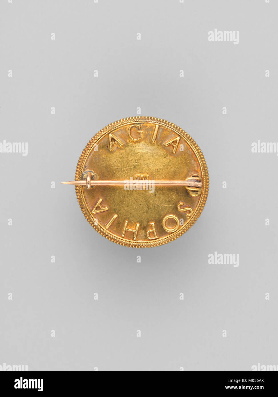 This brooch features a Greek Cross design, highlighting its intricate ...