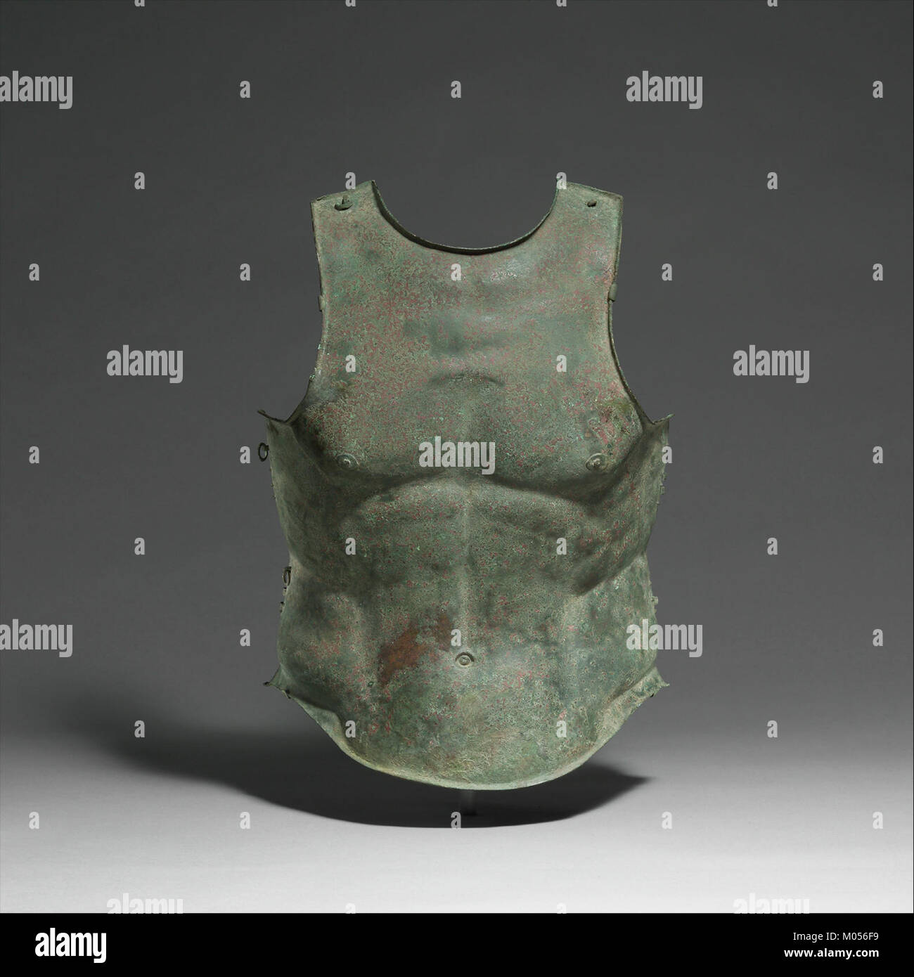 This bronze cuirass is an example of ancient body armor, likely from ...