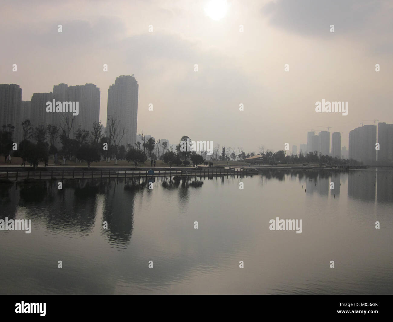 The image depicts buildings near Meixi Lake in Changsha, China. These ...