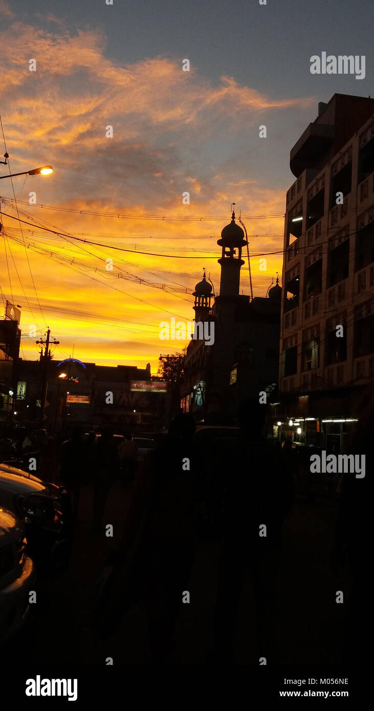 A brightening sunset captures the vibrant transition of colors in the ...
