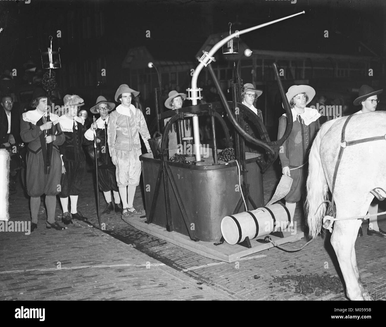 A historical photograph showing a fire brigade procession in the ...
