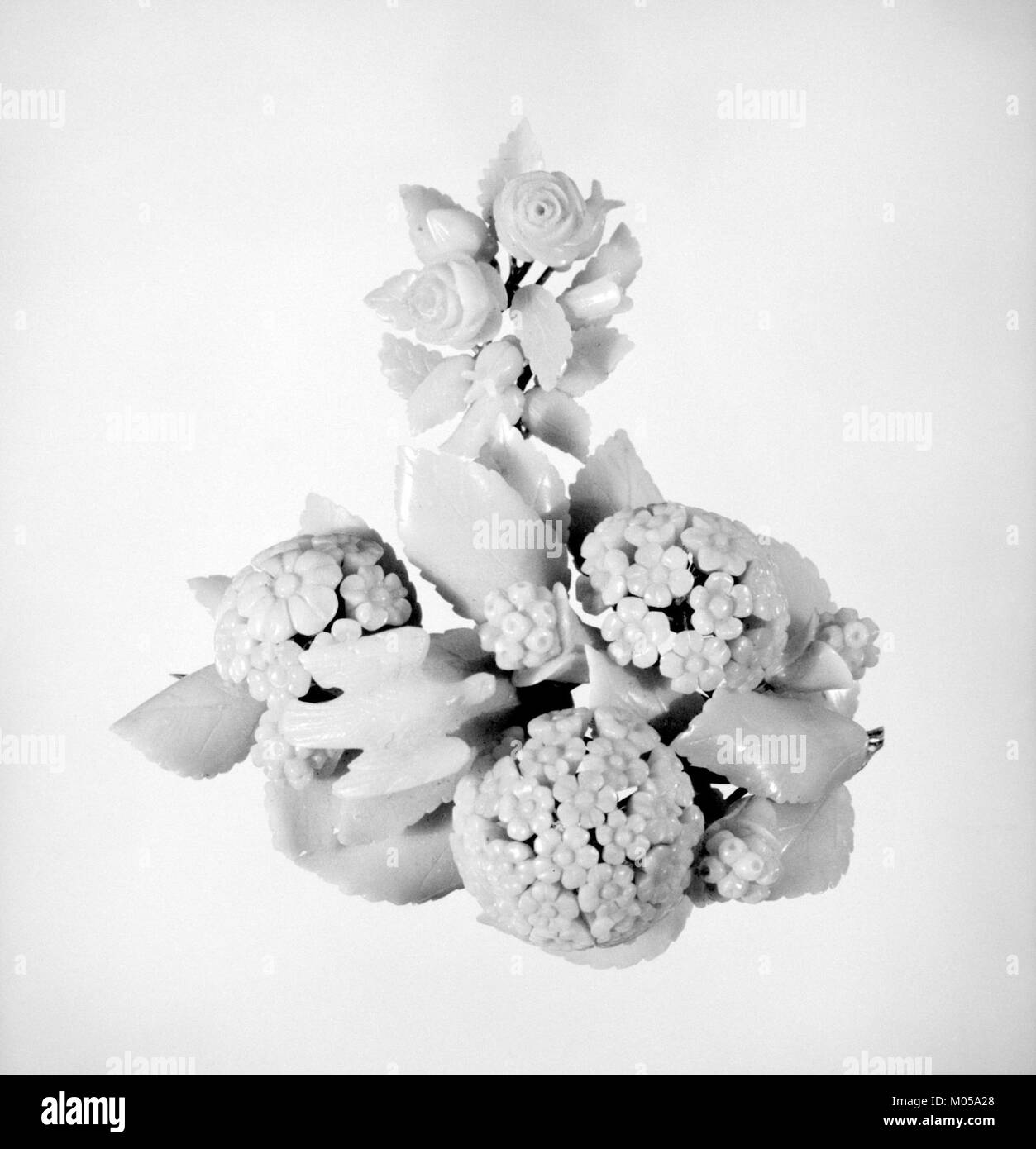 This brooch with pendant, part of a parure, is a refined example of ...