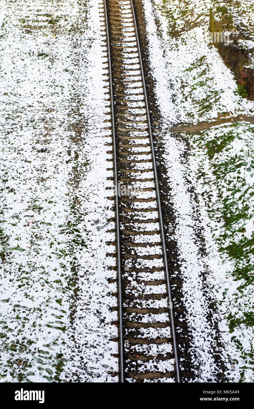 Railroad track covered with snow top view Stock Photo - Alamy