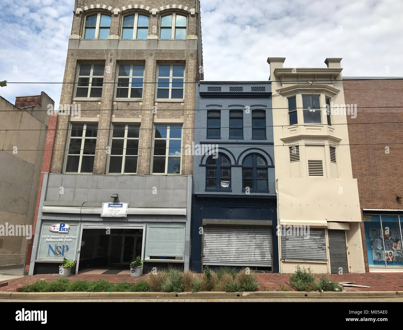 A photograph of buildings located on Howard Street in Baltimore ...