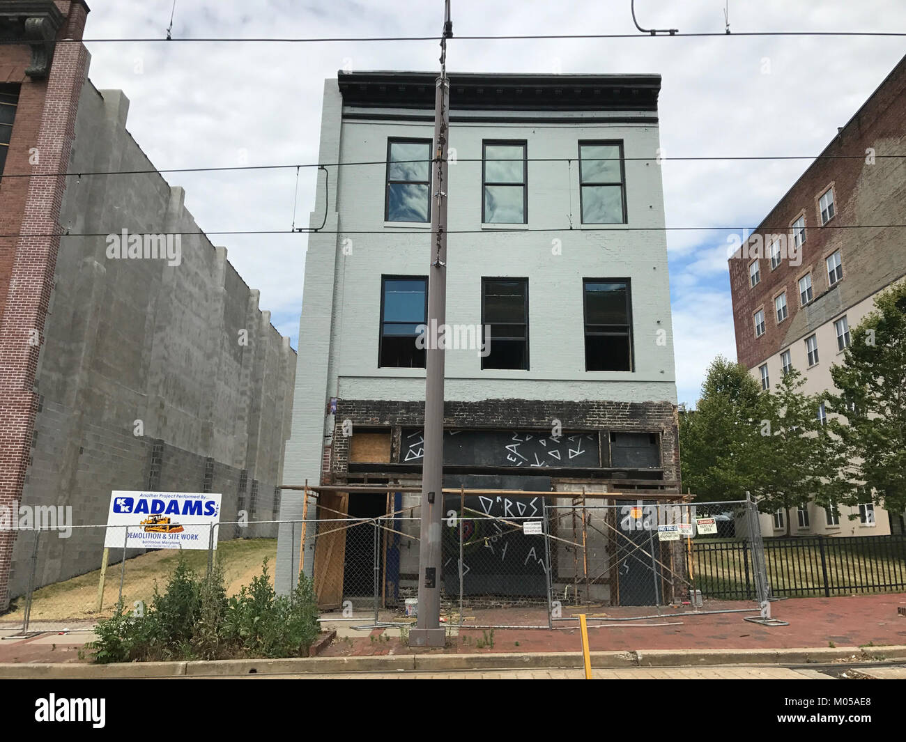 This photograph showcases buildings along Howard Street in Baltimore ...