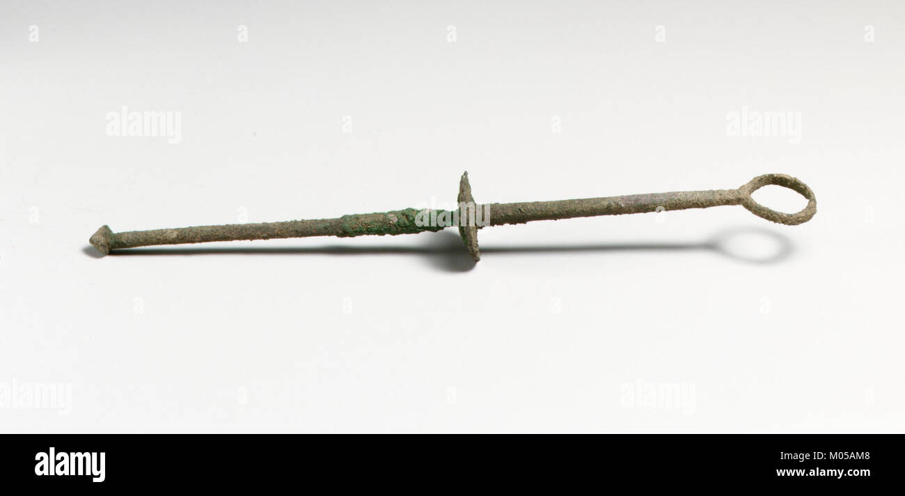 The bronze dipping or stirring rod is a historical artifact, likely ...
