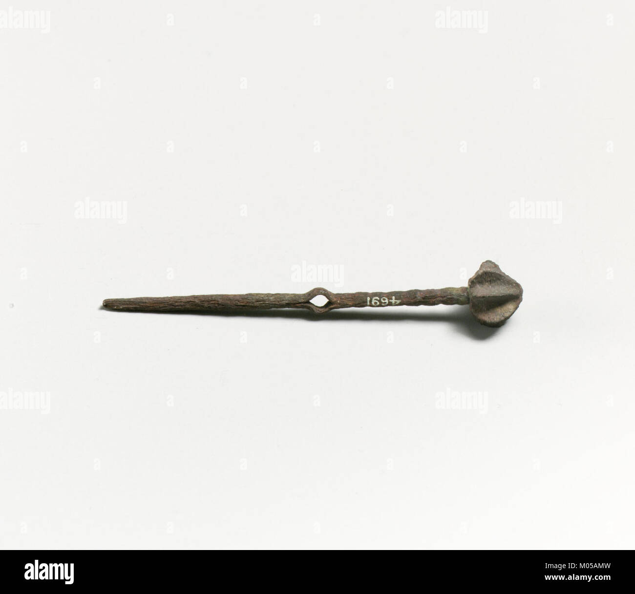 A bronze eyelet-type pin from the collection of the Metropolitan Museum ...