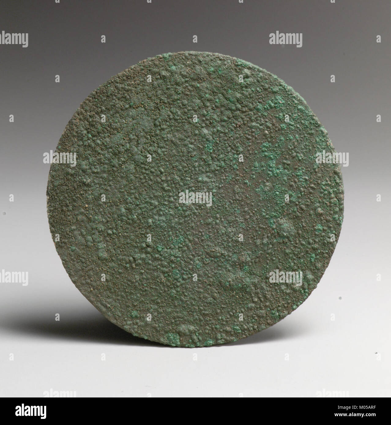 The bronze disk mirror is an ancient artifact, showcasing intricate ...