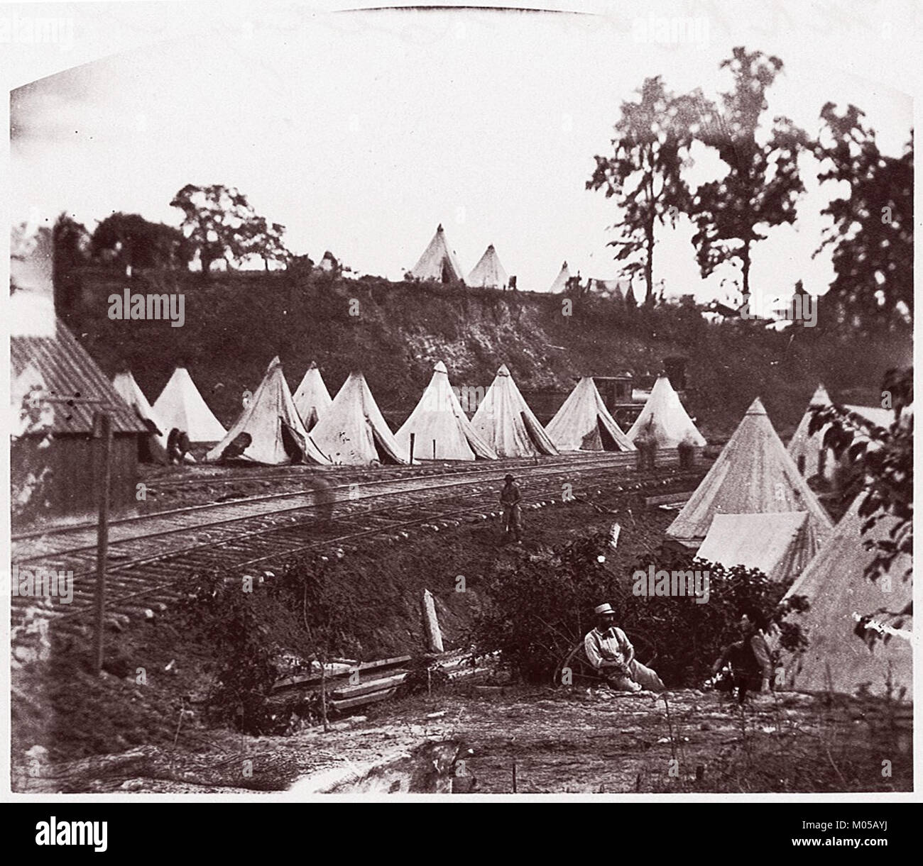This photograph depicts a U.S. Military Railroad camp at City Point ...