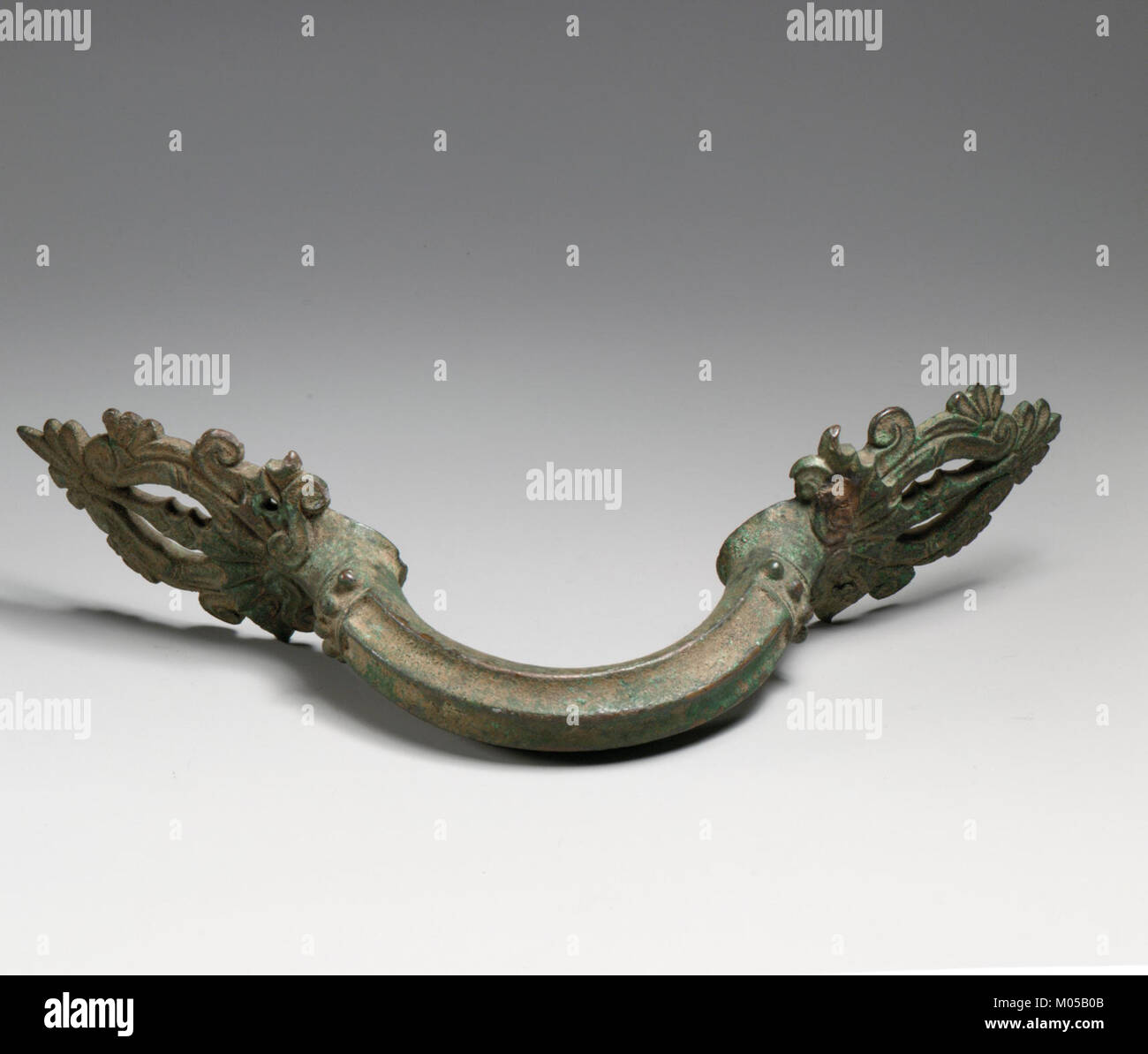 The bronze handle of a hydria, a type of ancient Greek water jar, is ...