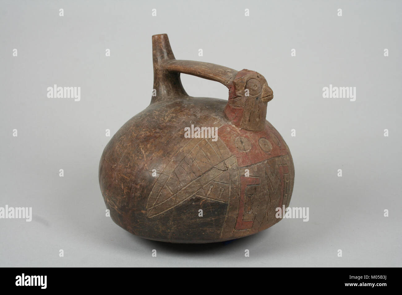 A glass bottle shaped like a falcon, crafted as part of ancient ...