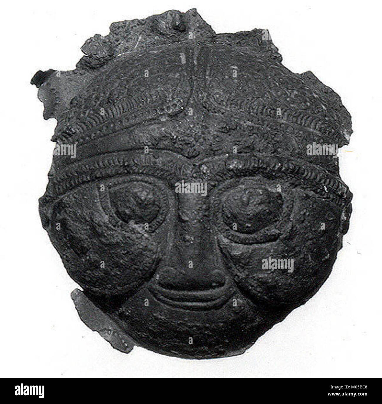 This object, identified as a boss from a disc-headed pin, is a ...