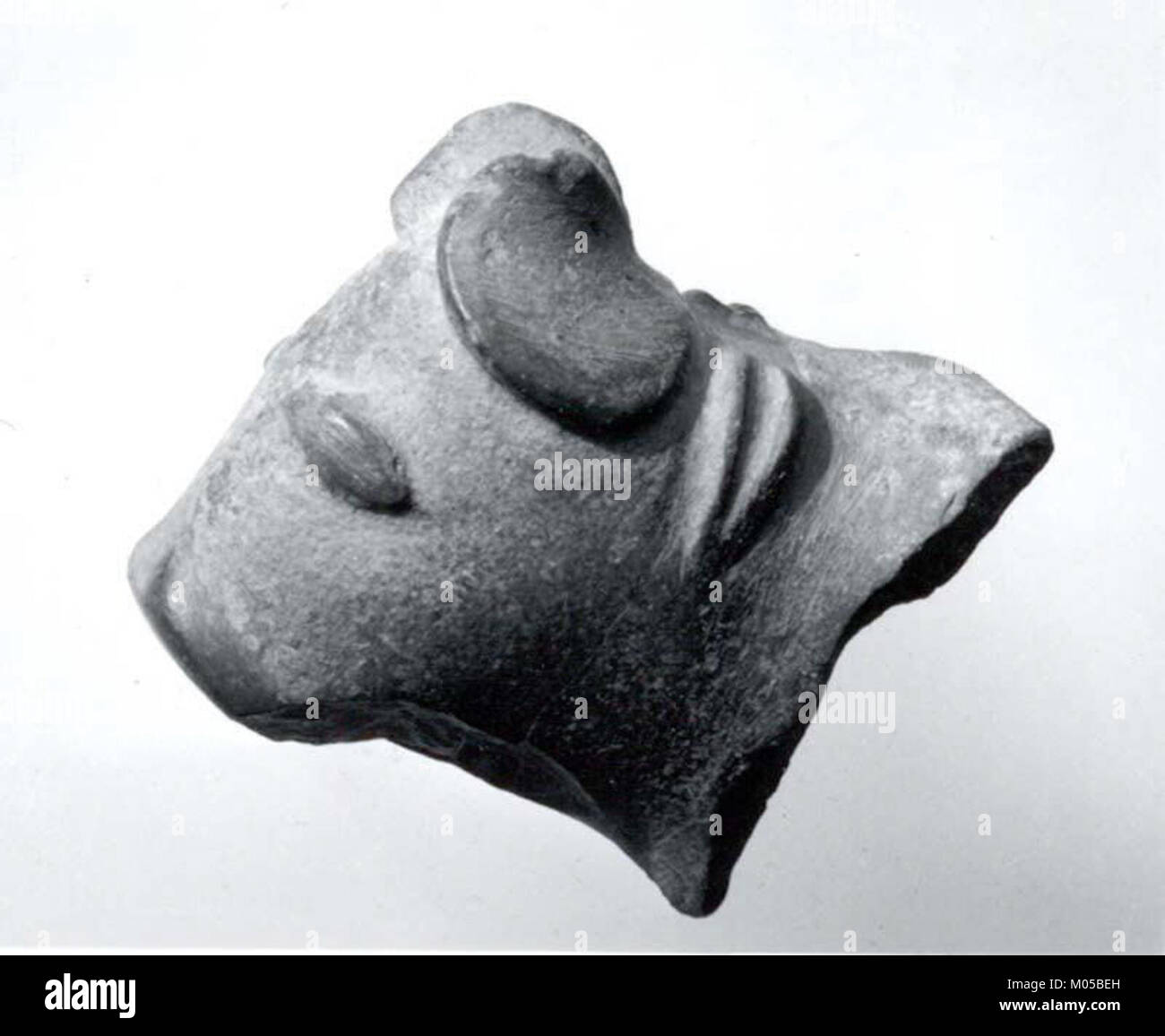 The bull head-shaped spout is part of an ancient vessel, showcasing the ...