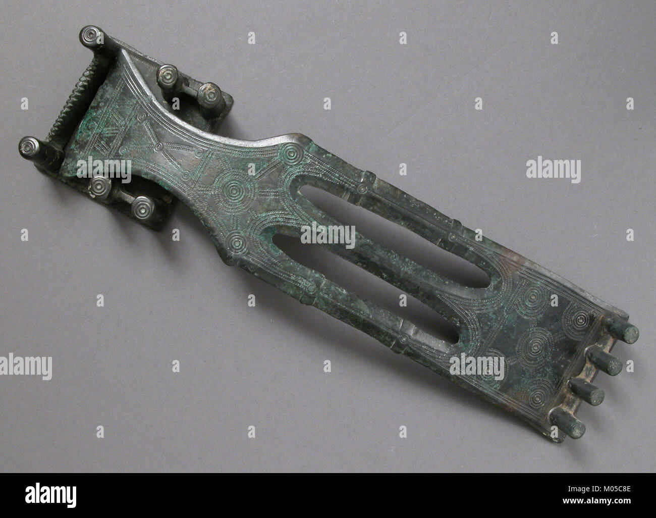 The 'Buckle and Plate' from the MET collection is a metal artifact ...