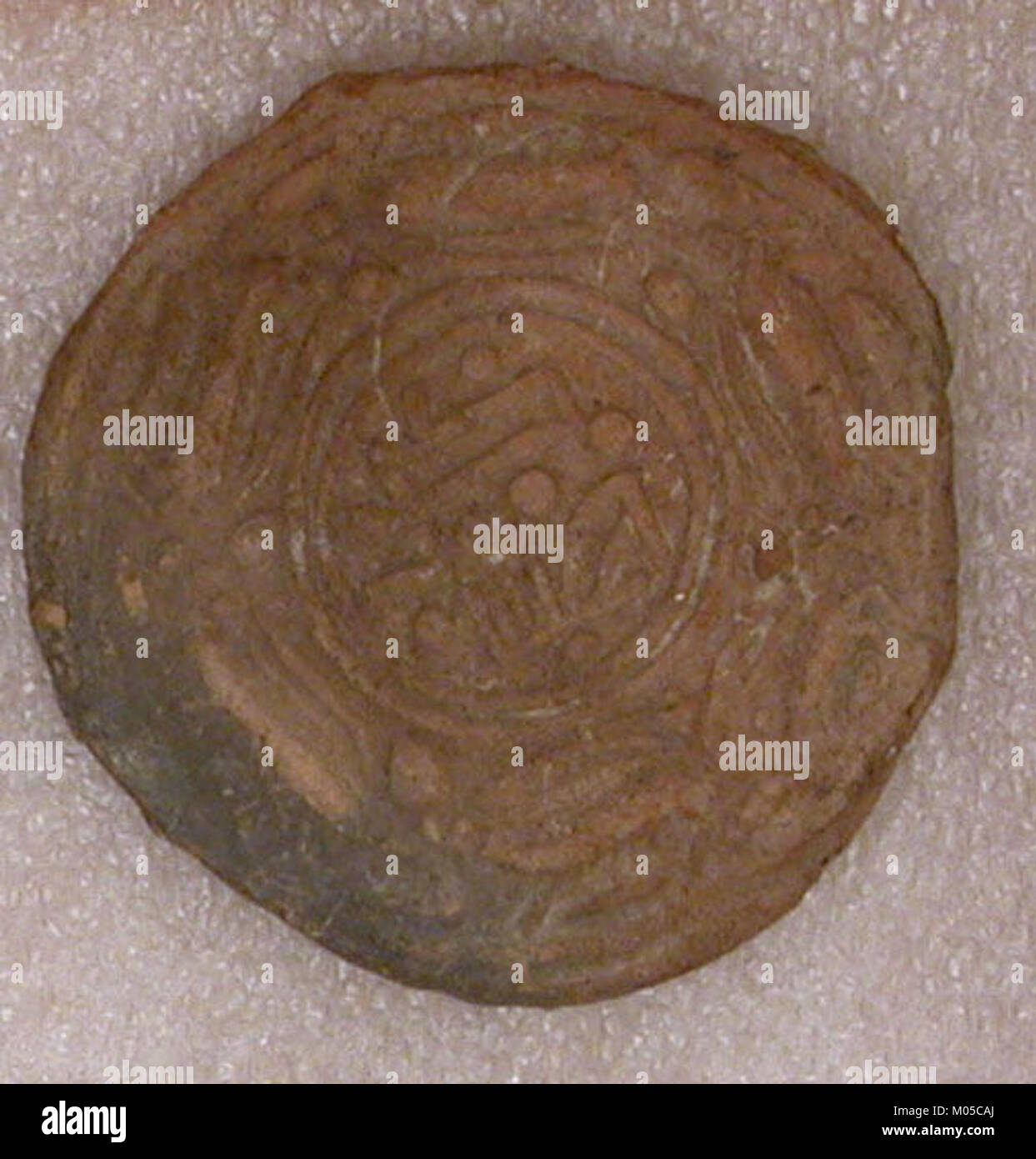 A close-up photograph of a bread seal, cataloged in the MET collection ...