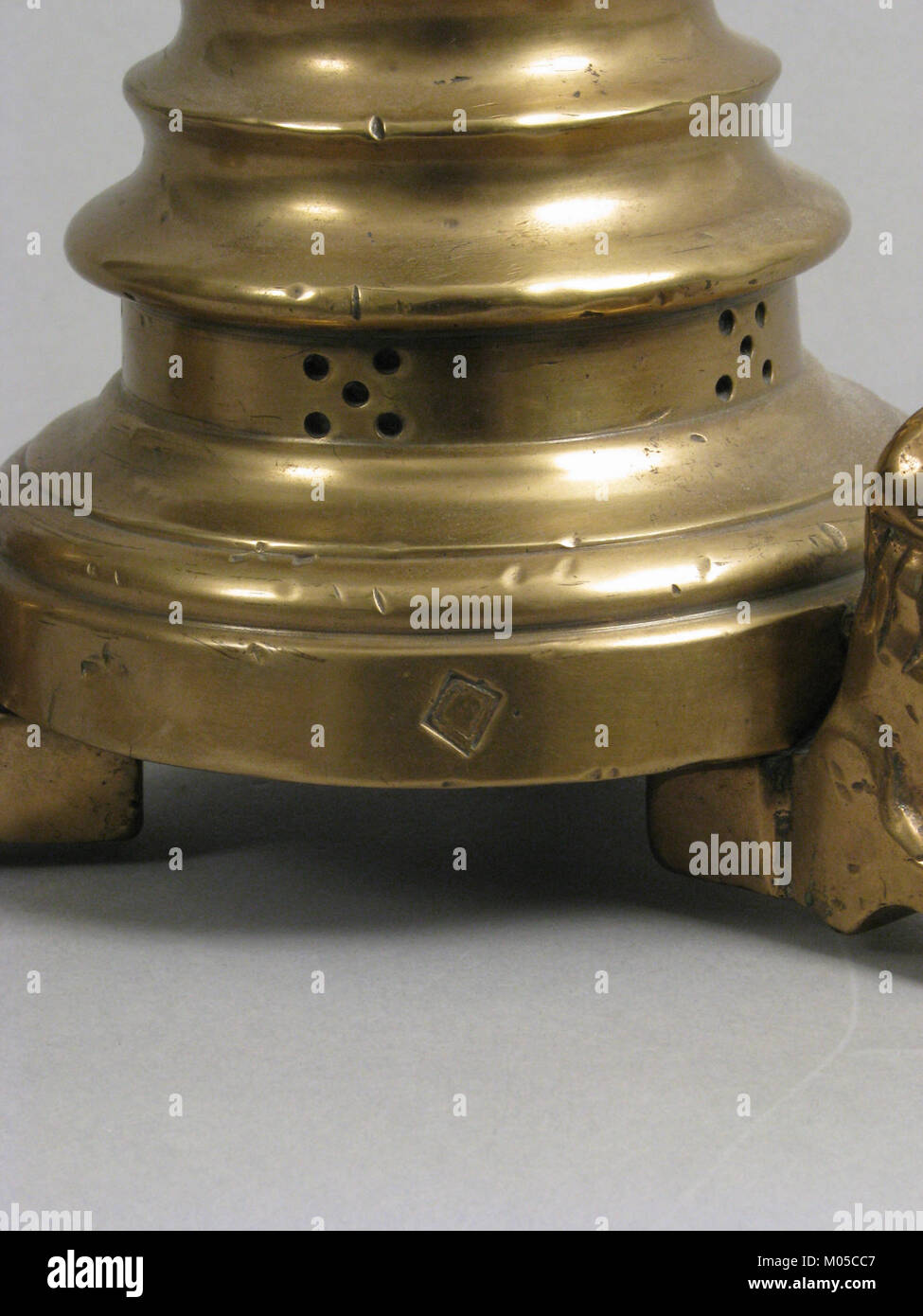 A pricket candlestick, an antique item designed to hold a candle on a ...