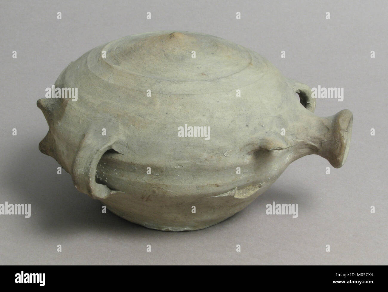 This image depicts a pilgrim-style bottle from the 17th century ...