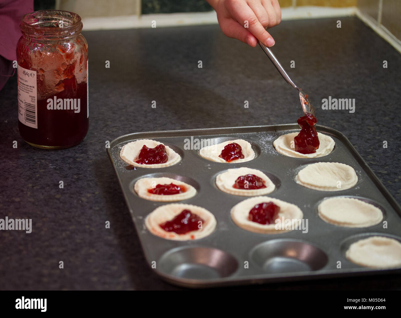 Making jam tarts Stock Photo - Alamy