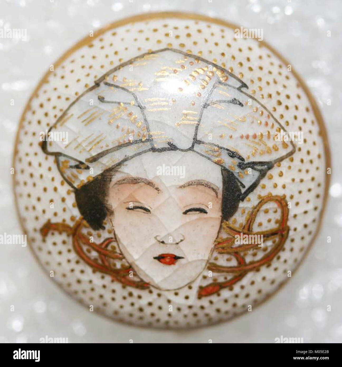 The object depicted is a button, cataloged as MET 50.231.407, and is ...