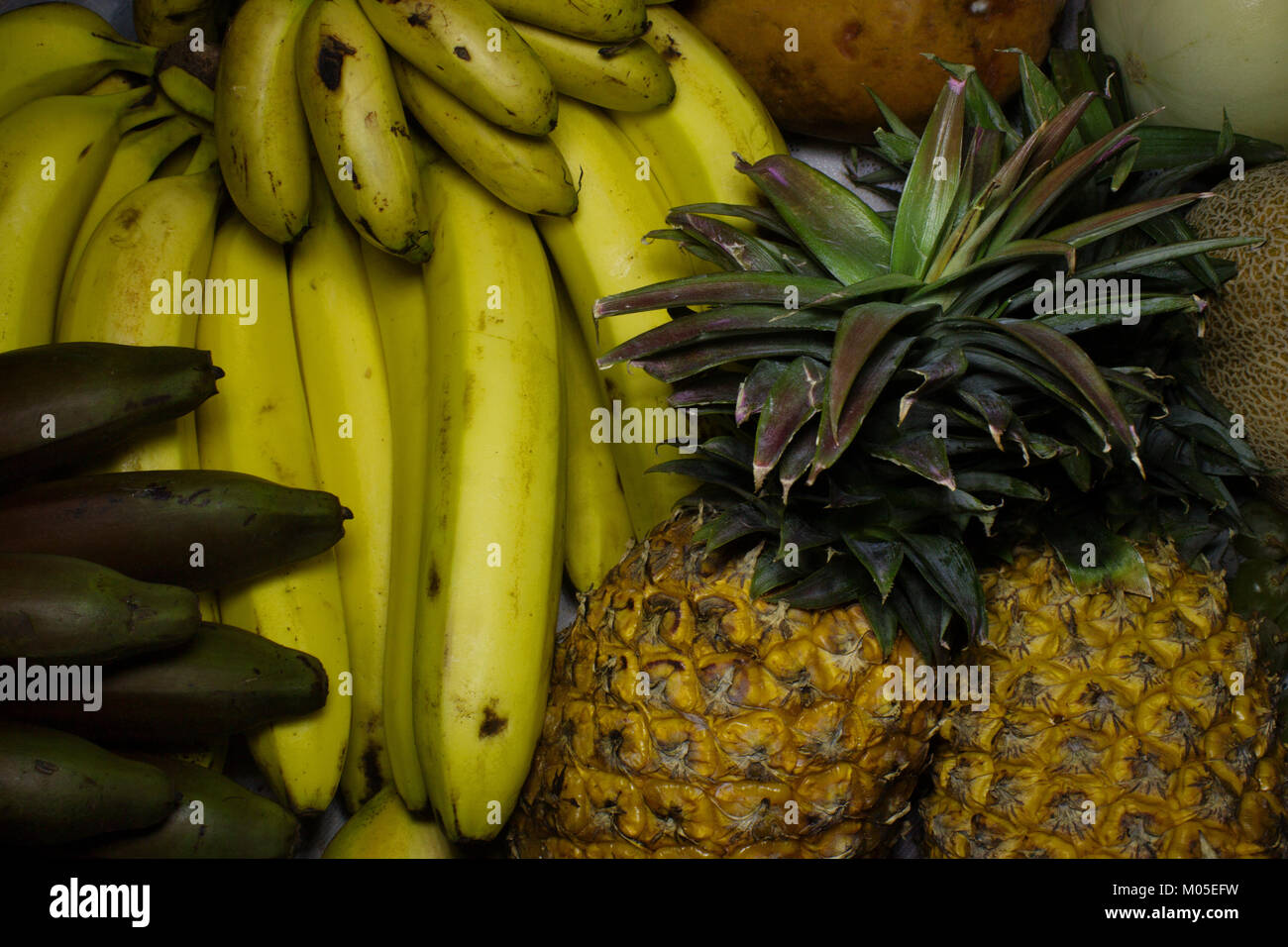 stack of different fruits, banana, cavendish, mini banana, pineapple ...