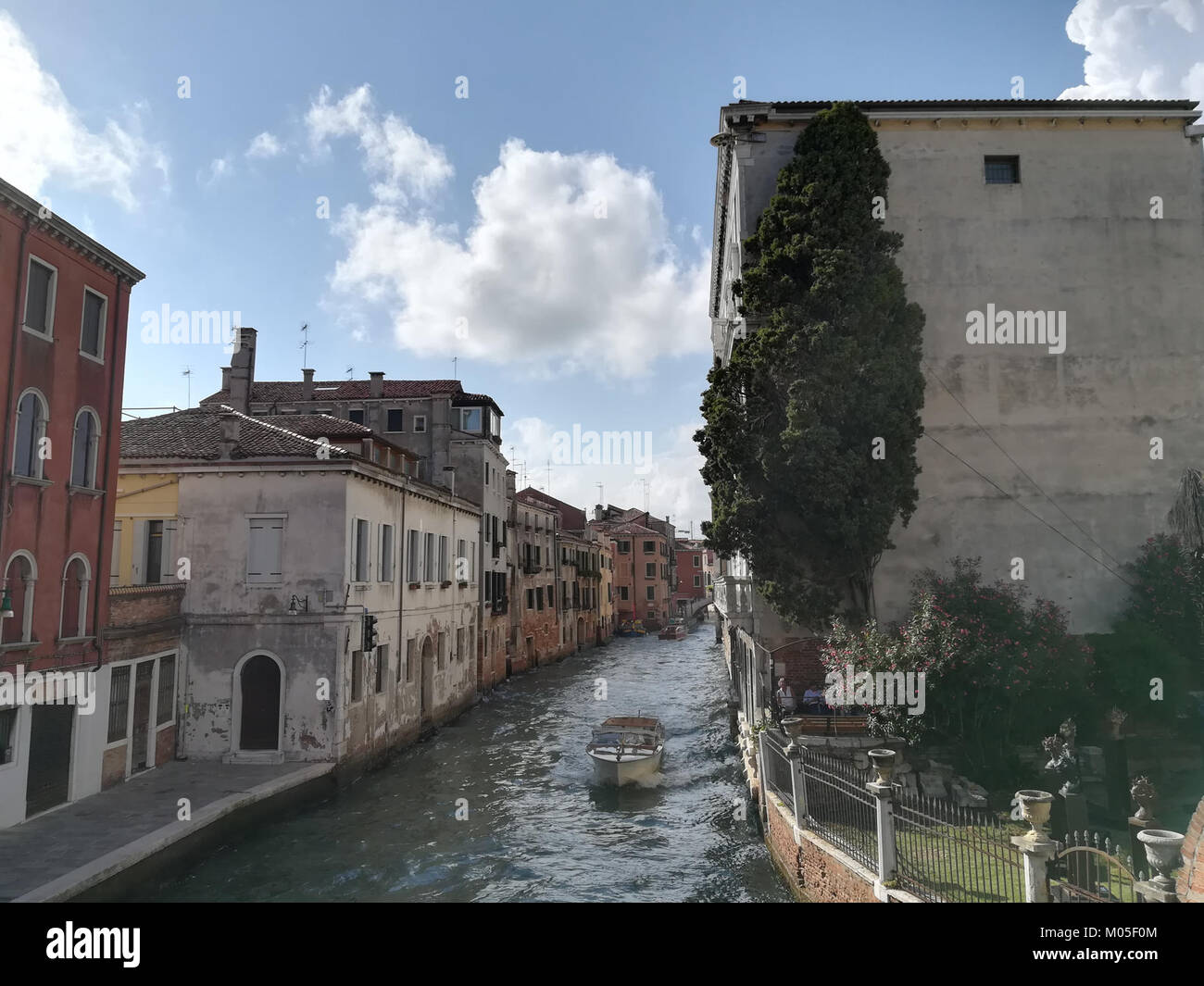 A canal and boat scene in Venice, Italy, captured in July 2017 ...
