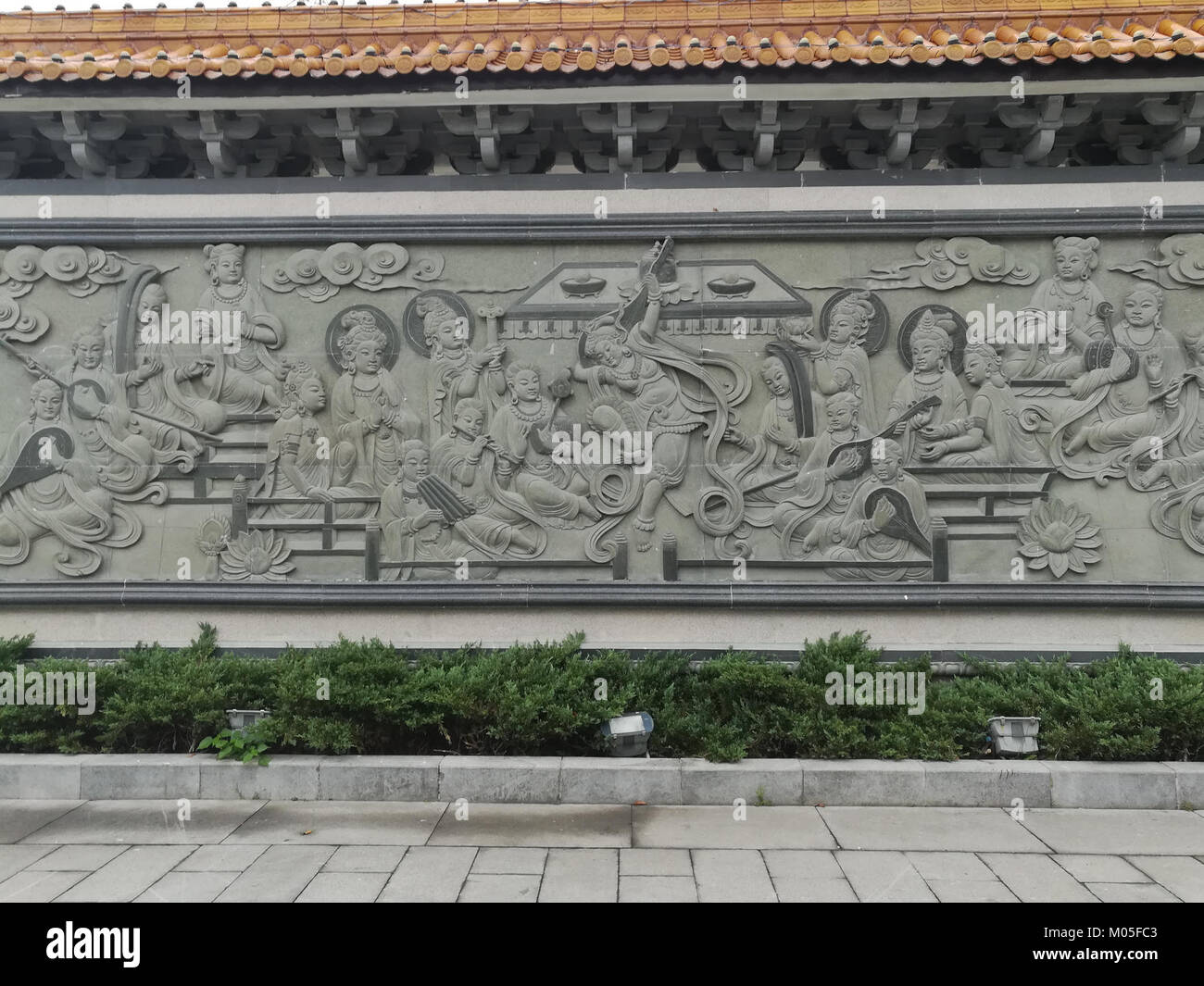 The Buddha relief wall at Miyin Temple is a significant example of ...