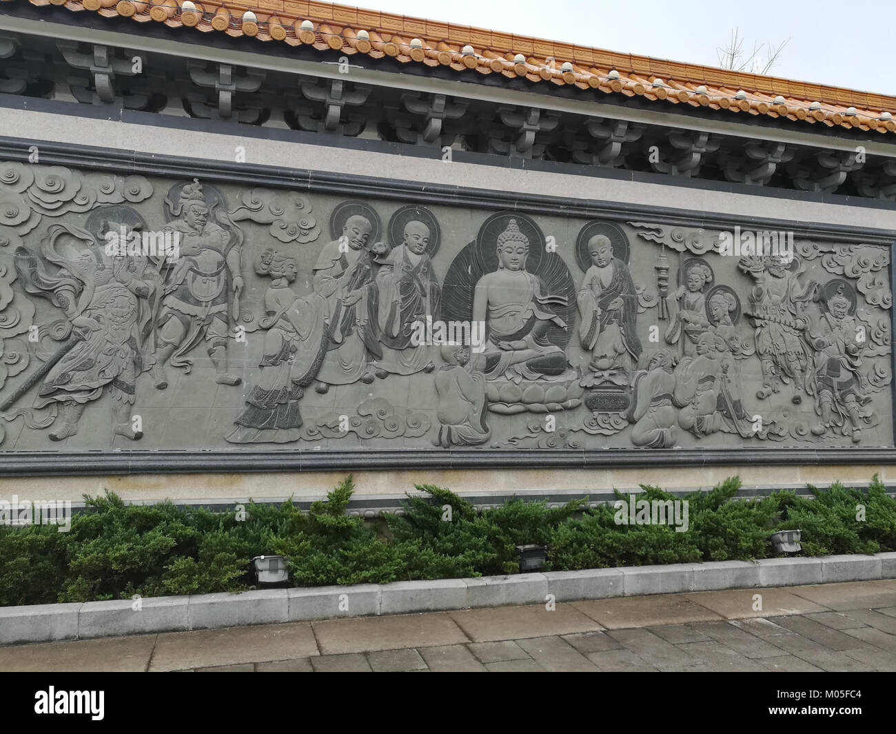 The Buddha relief wall at Miyin Temple is a significant example of ...