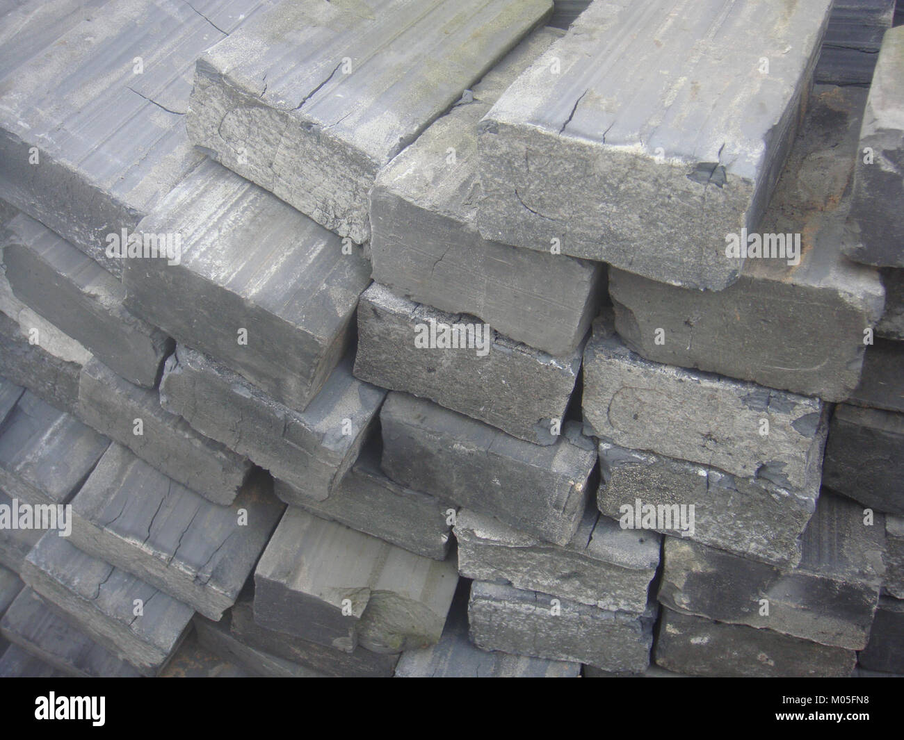 Photograph showcasing the traditional brick-making process in Hainan ...