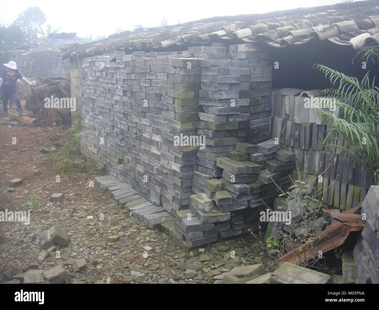 An image documenting the traditional brick-making process in Hainan ...
