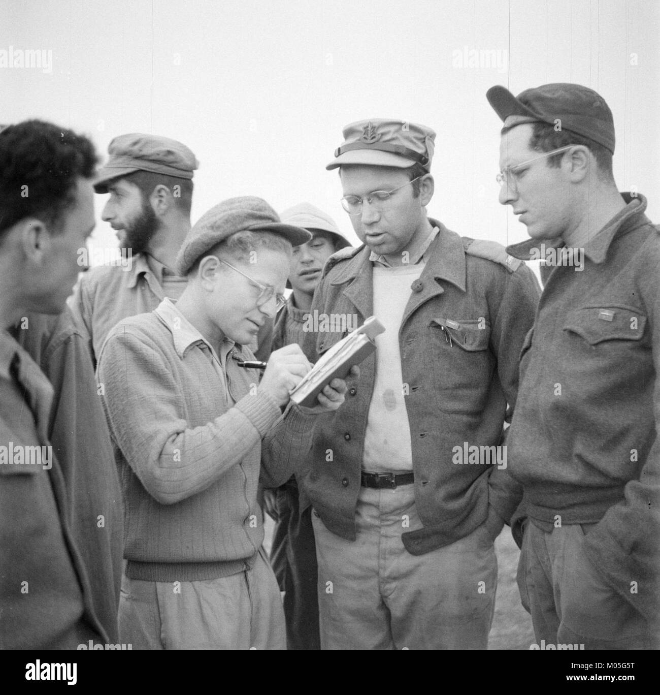 This image captures the morning meeting of a construction team from the ...