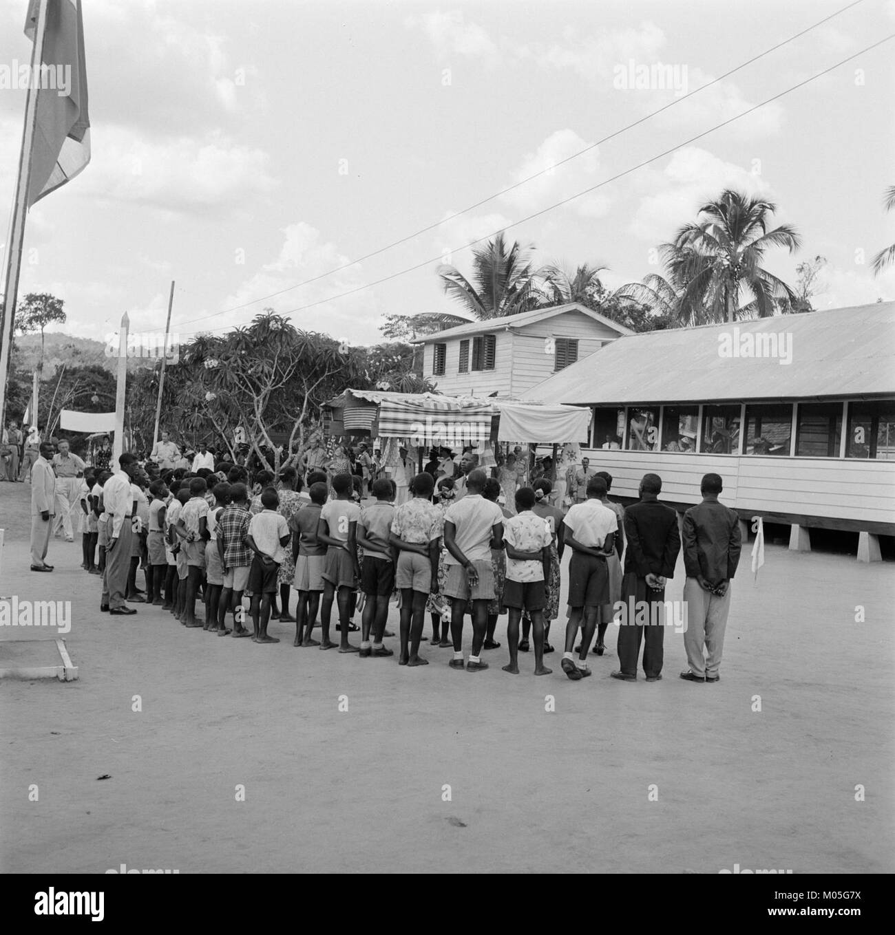 This image depicts children of the Bosland Creole community waiting at ...