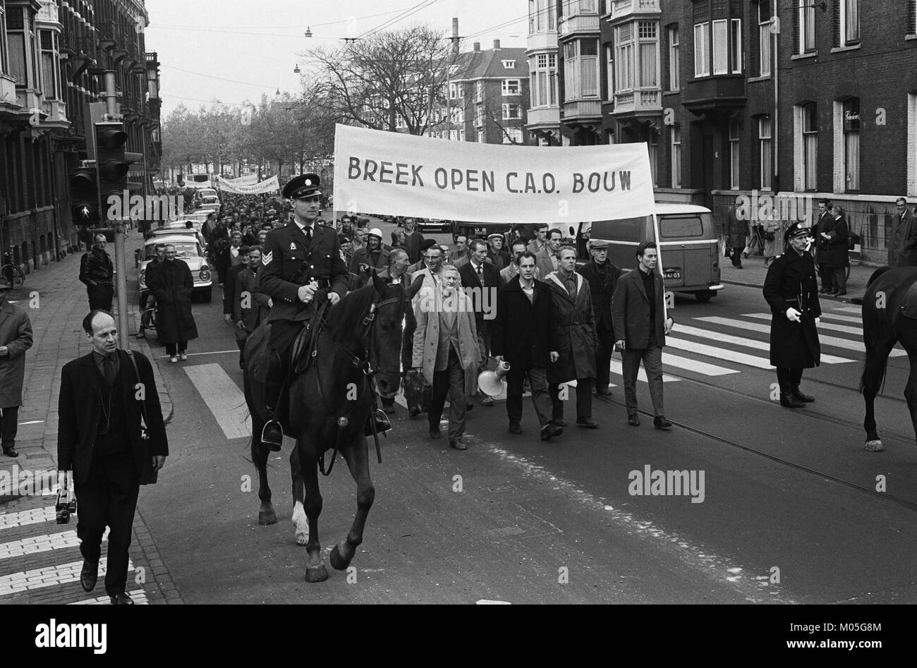 This image shows construction workers on strike in the Netherlands. It ...