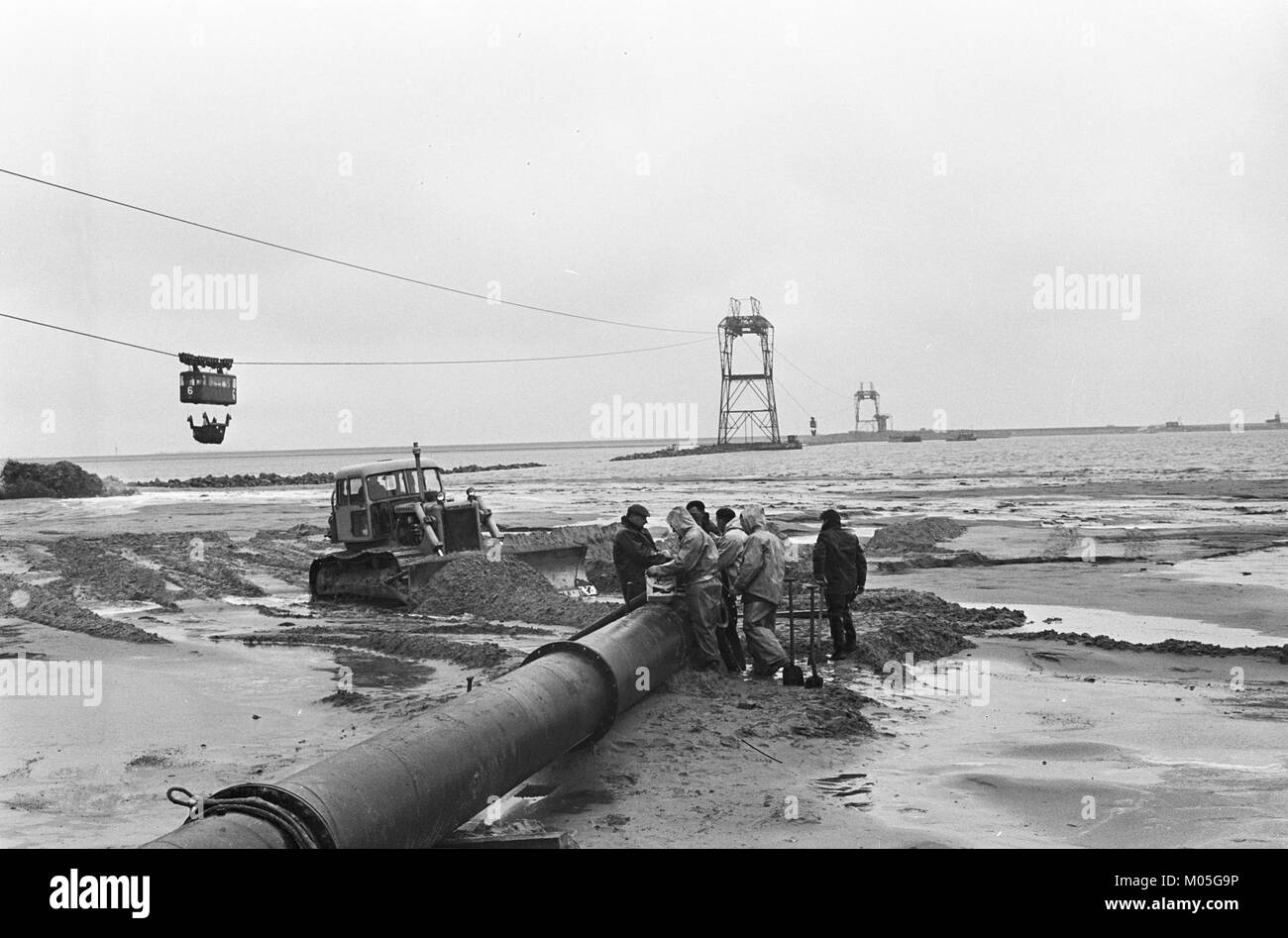The construction of the Grevelingendam in the Netherlands, featuring ...